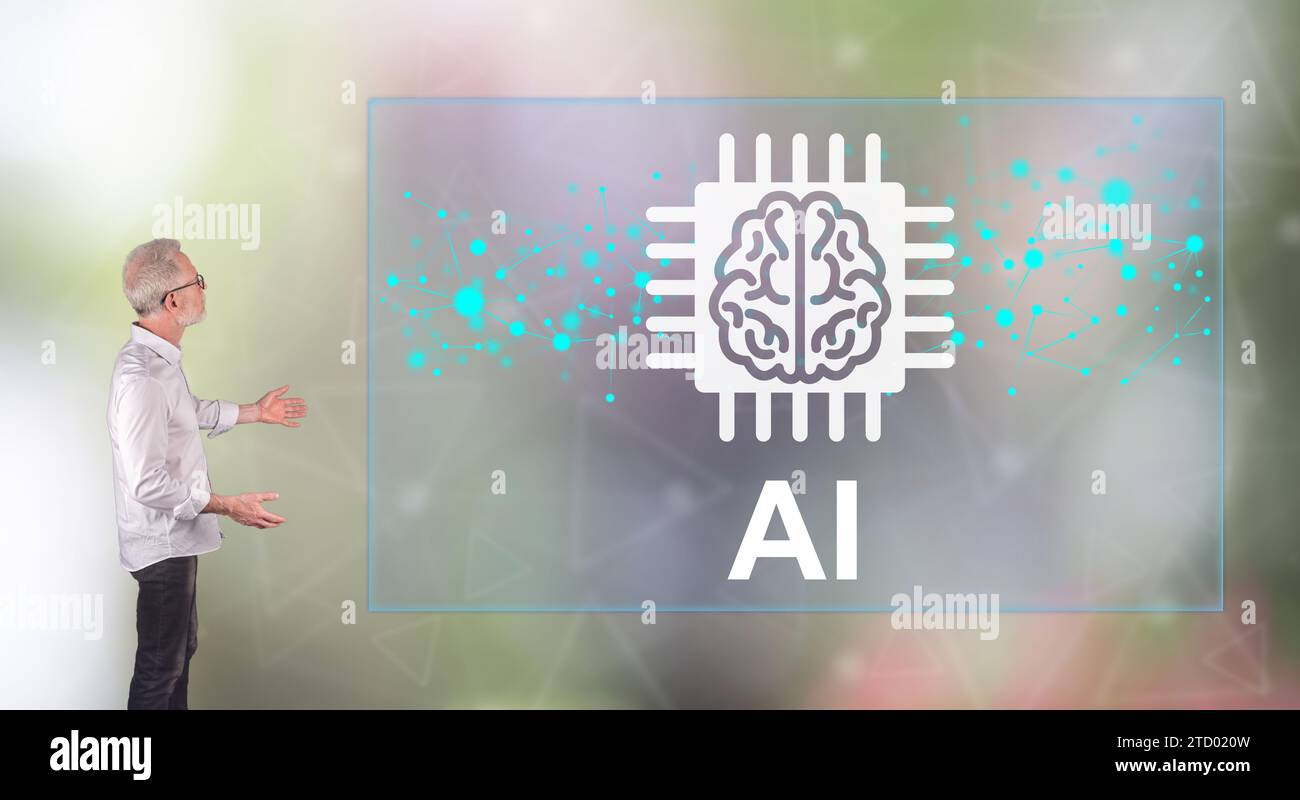 Businessman showing an ai concept on a wall screen Stock Photo - Alamy