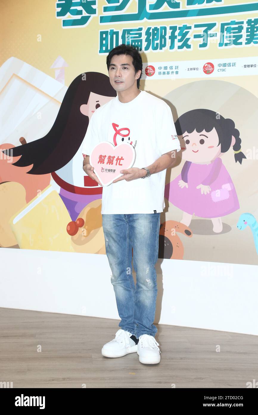Taiwanese actor Mike He attends a public welfare activity in Taipei ...