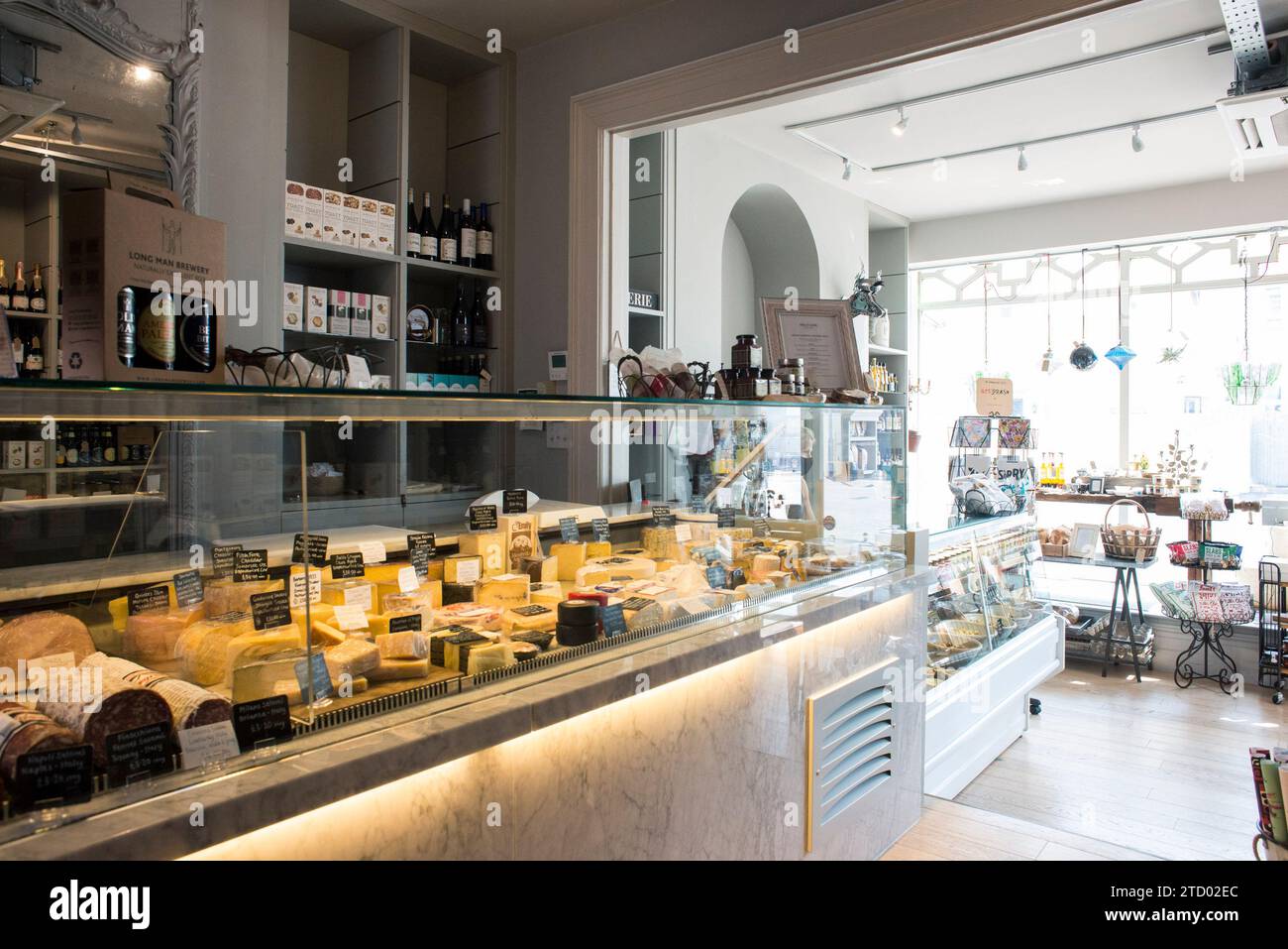 A cheese counter in a specialist local food shop with a great display ...
