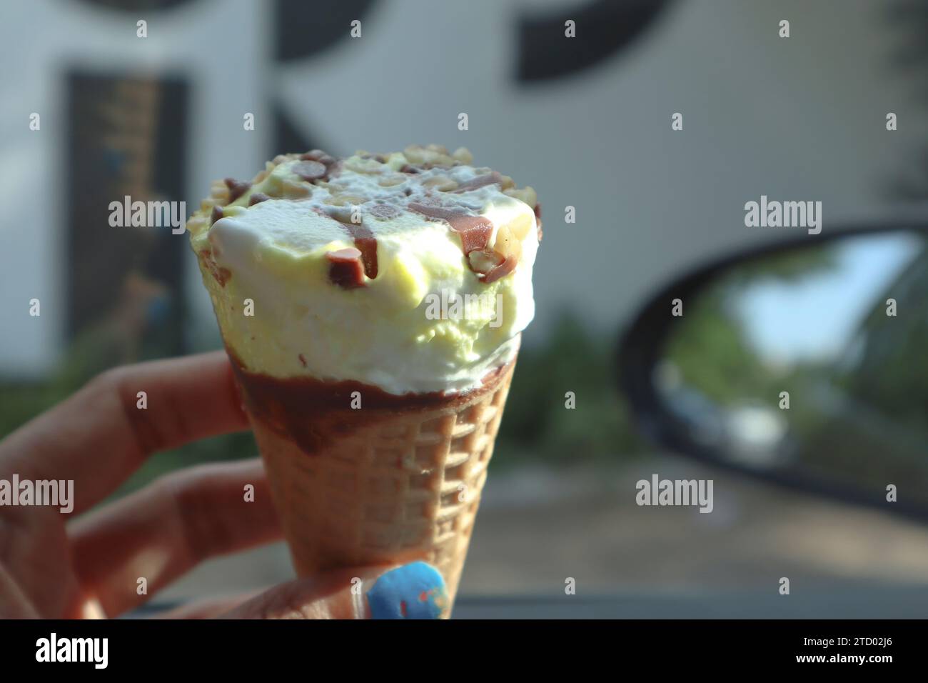 Female holding Cone icecream on outing Stock Photo - Alamy