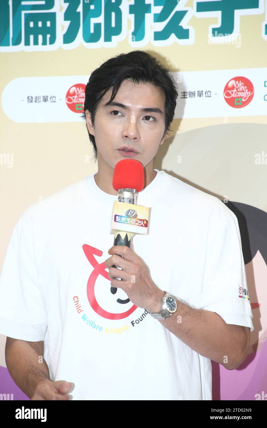 Taiwanese actor Mike He attends a public welfare activity in Taipei ...