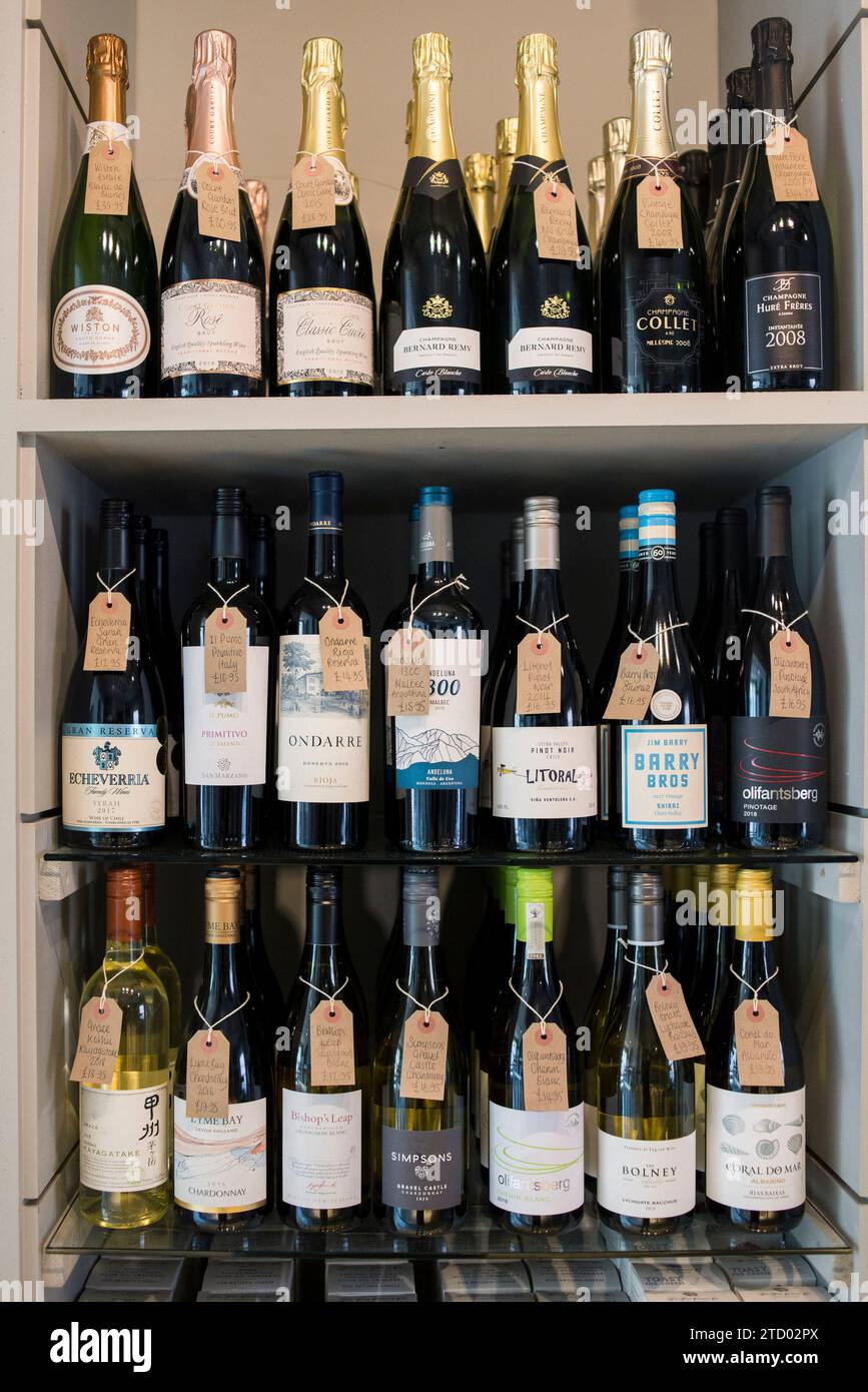 Shelves with high end bottles of wine and gin on display for sale in a ...