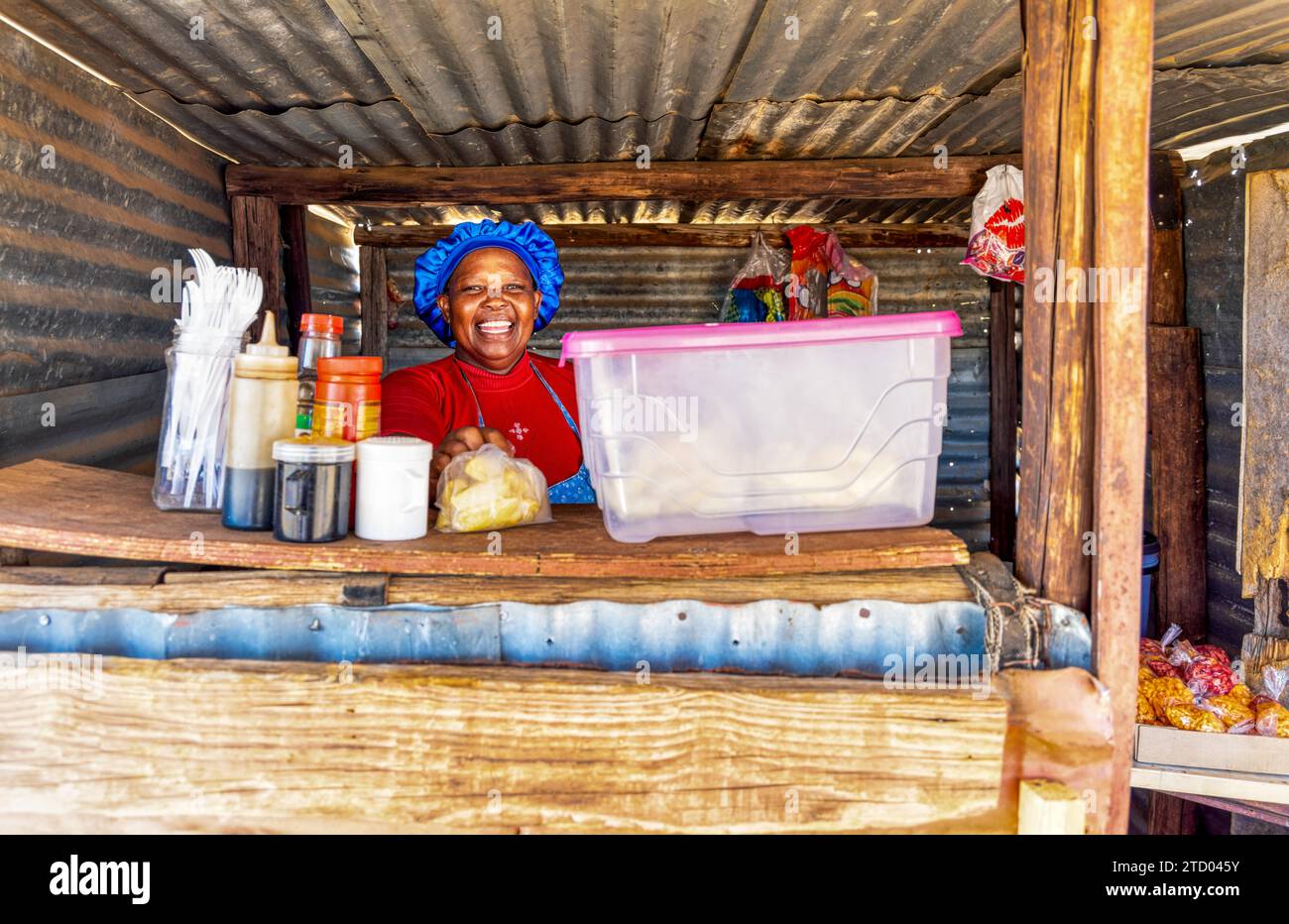 african woman selling potato chips in a shack in a village, Street ...
