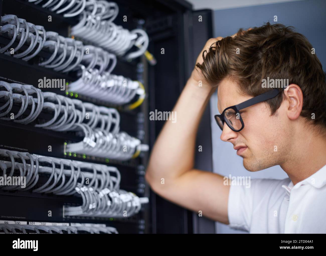 Server room, thinking and confused man with cables for connectivity ...