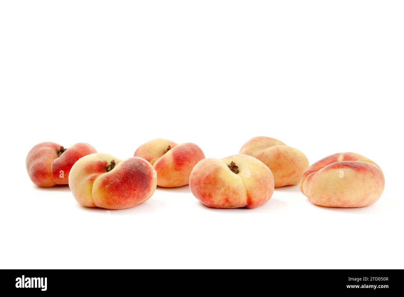 Several ripe chinese flat peach fruits or saturn peaches with soft ...