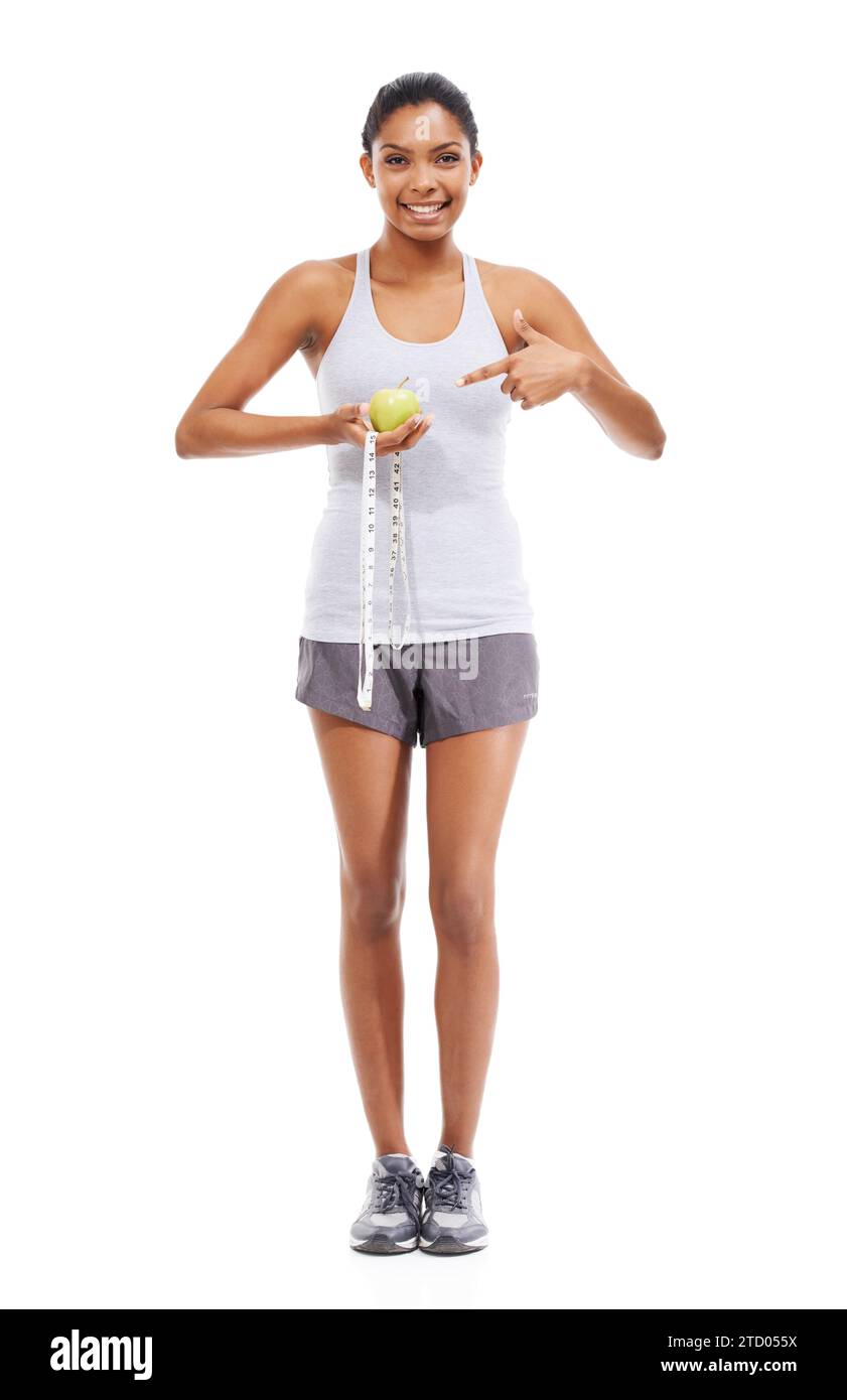 Woman, lose weight and pointing to measuring tape and apple in white ...
