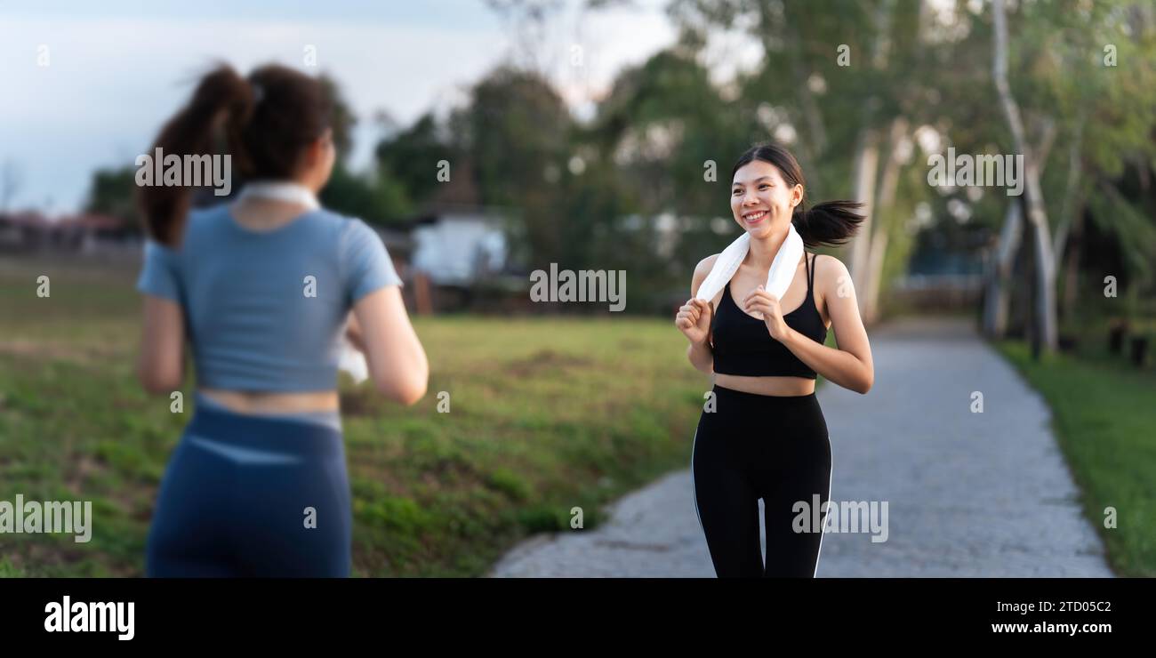 Jogging woman running in park on beautiful day off. Sport fitness model ...