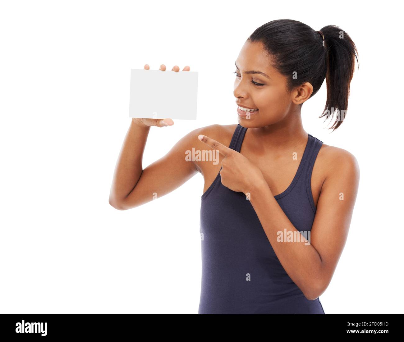 Smile, space and a woman pointing to an empty card in studio isolated ...