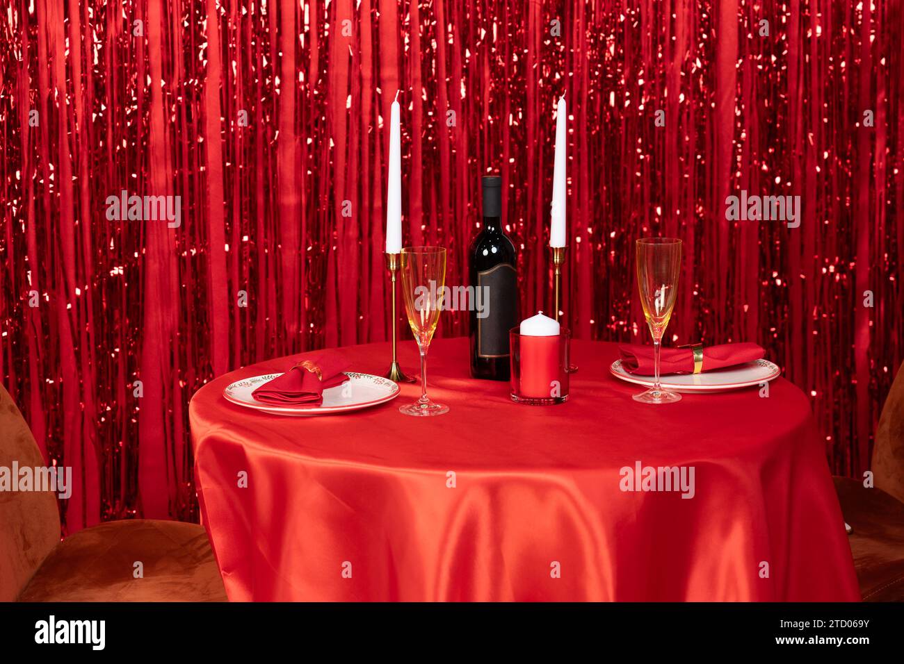 Romantically decorated table and hall in red color for dinner in a ...