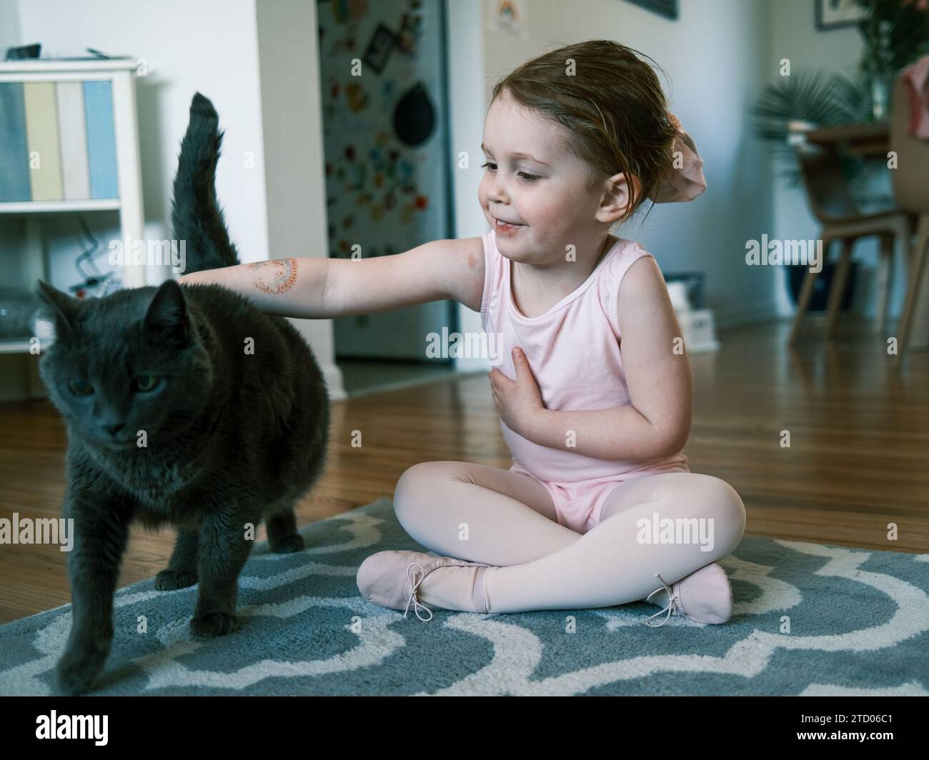 Happy Toddler in Ballet Outfit Smiling in Living Room Stock Photo - Alamy