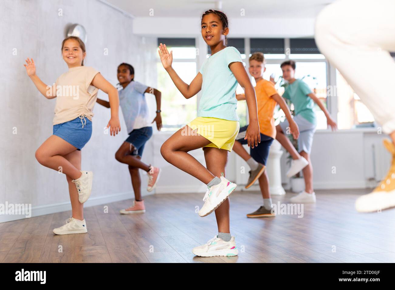 Energetic african american tween girl practicing vigorous dance in ...