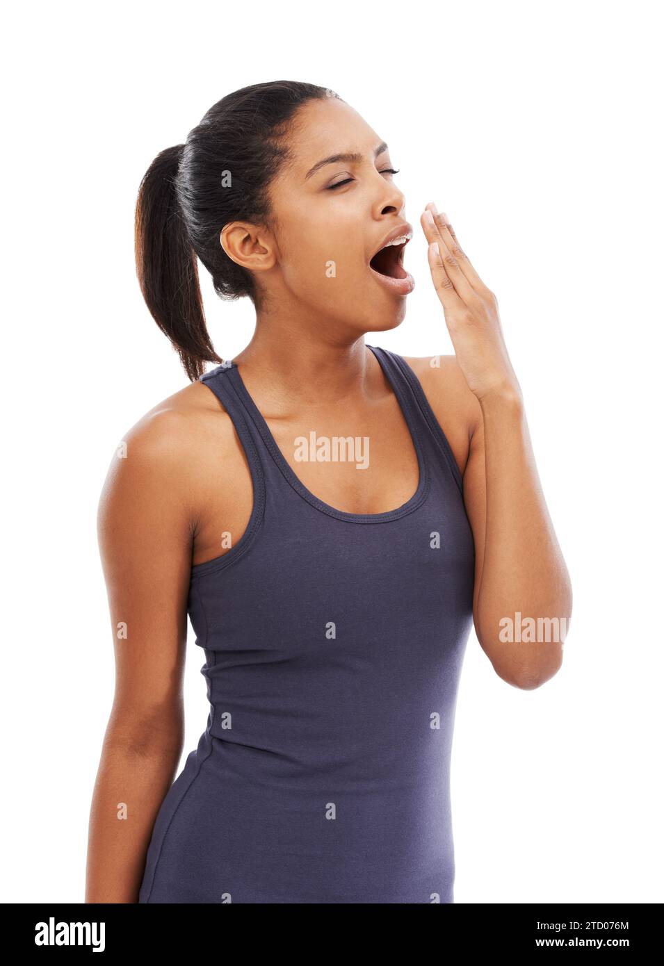 Tired, yawn and young woman in studio with fatigue, exhaustion or ...