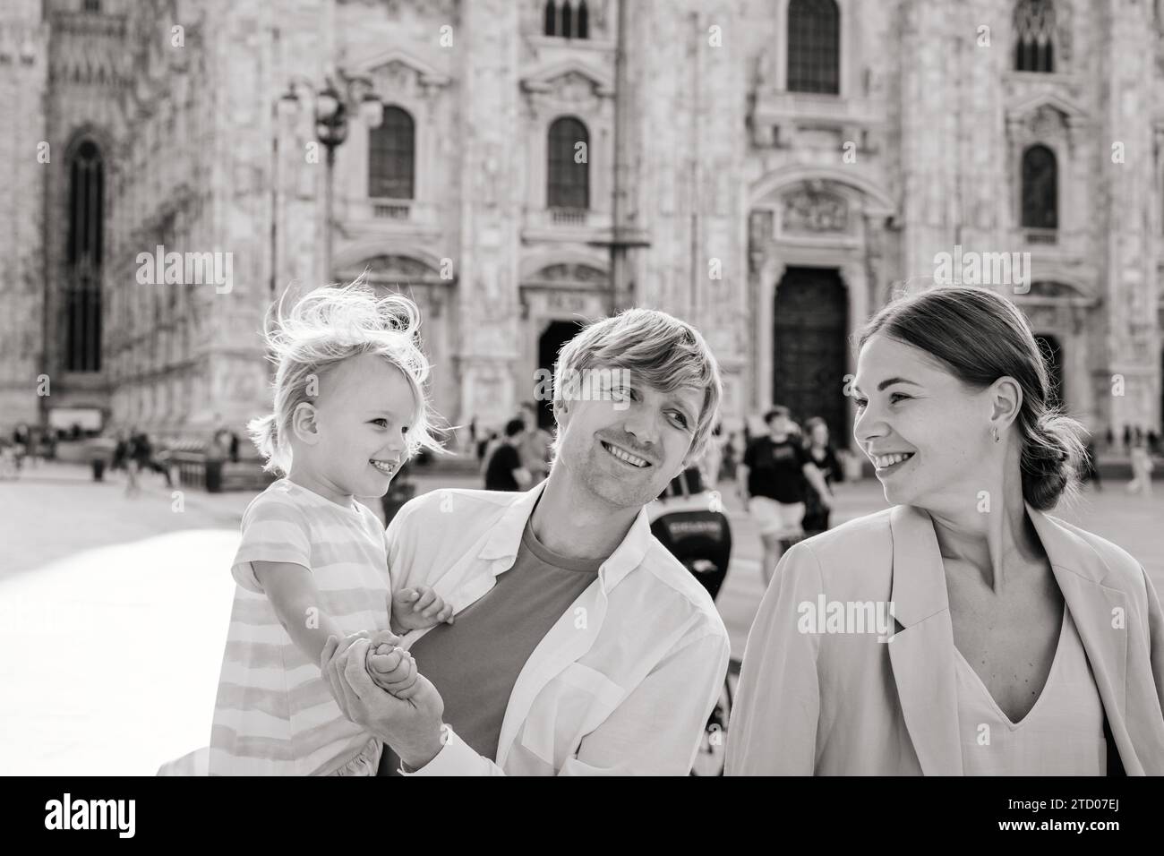 Happy family with a child on the background of the Duomo in Milan Stock ...