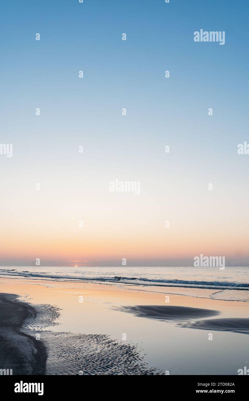 Sun peeking over horizon at sunrise on Hilton Head Island Stock Photo ...