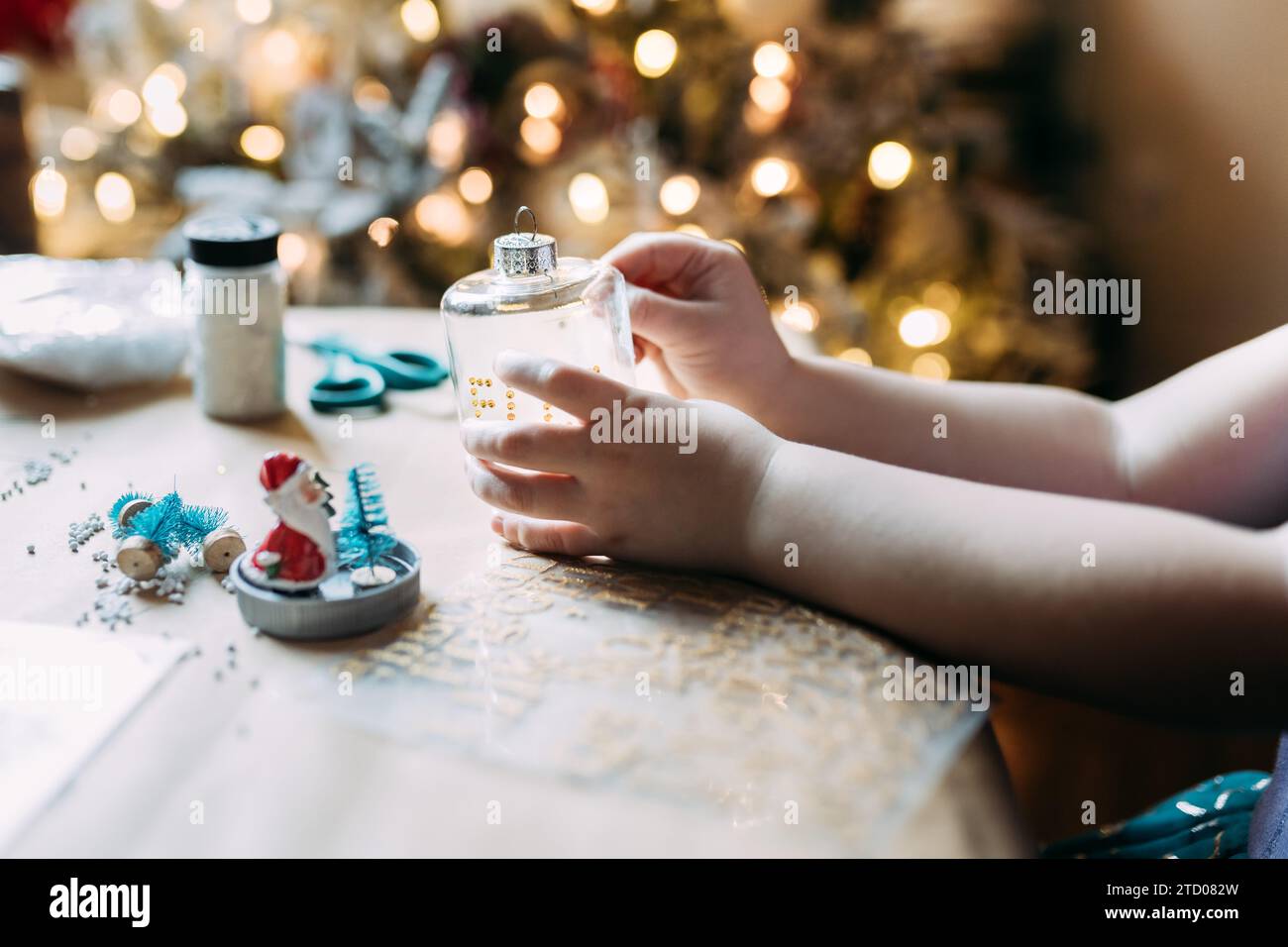 Close up of child's hands making handmade christmas ornaments Stock ...