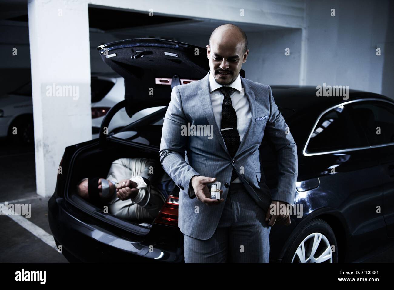 Man in trunk of car, kidnapping and criminal with money, danger and ...
