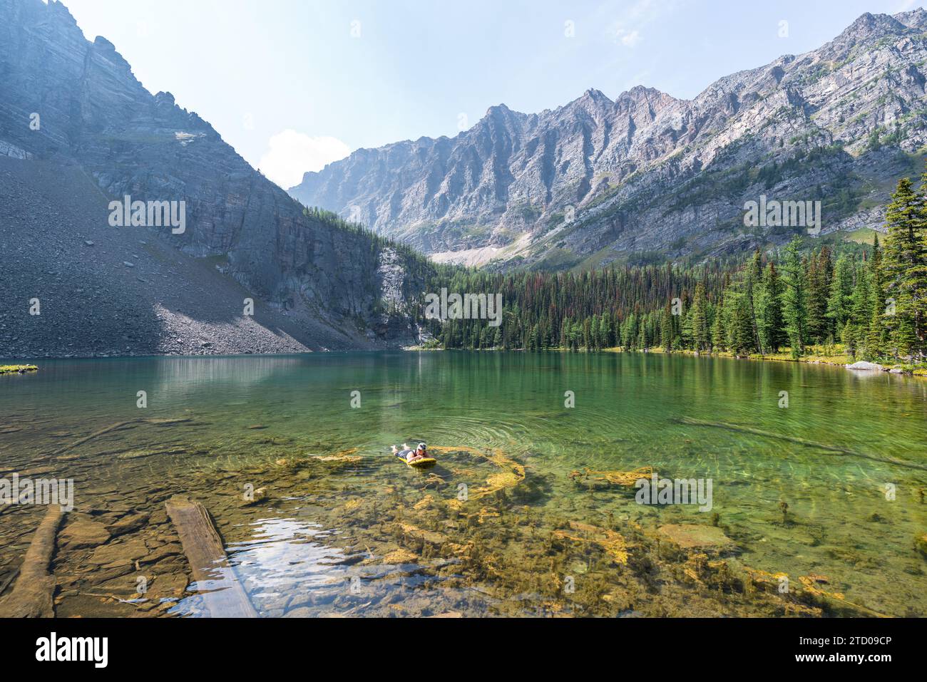 Relaxing In Hidden Alpine Lake Stock Photo - Alamy