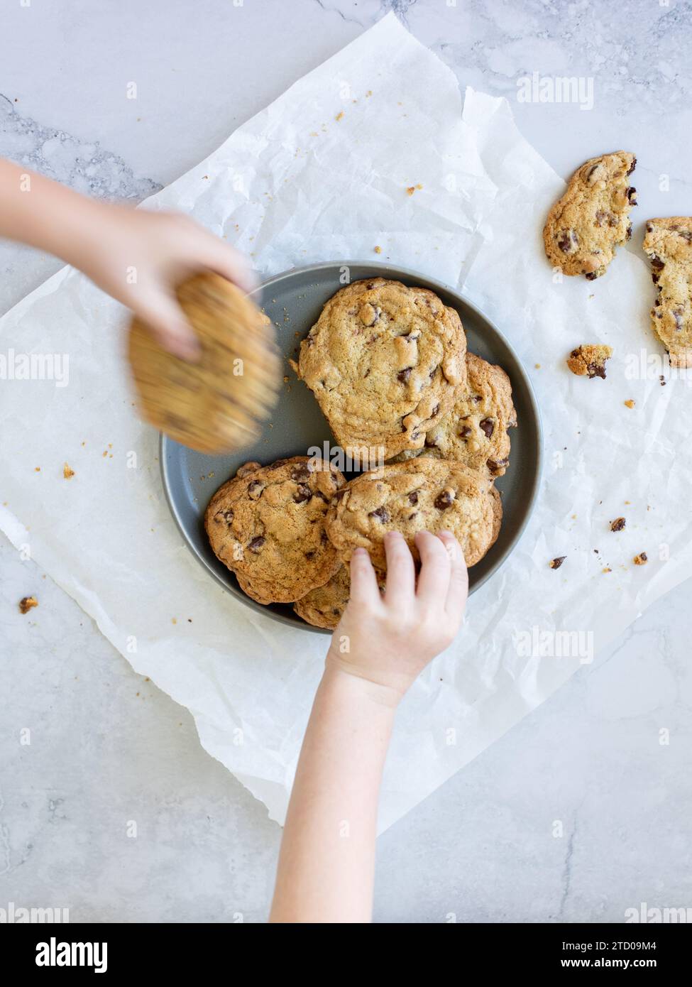 childrens hands reaching for homemade chocolate chip cookies on Stock ...