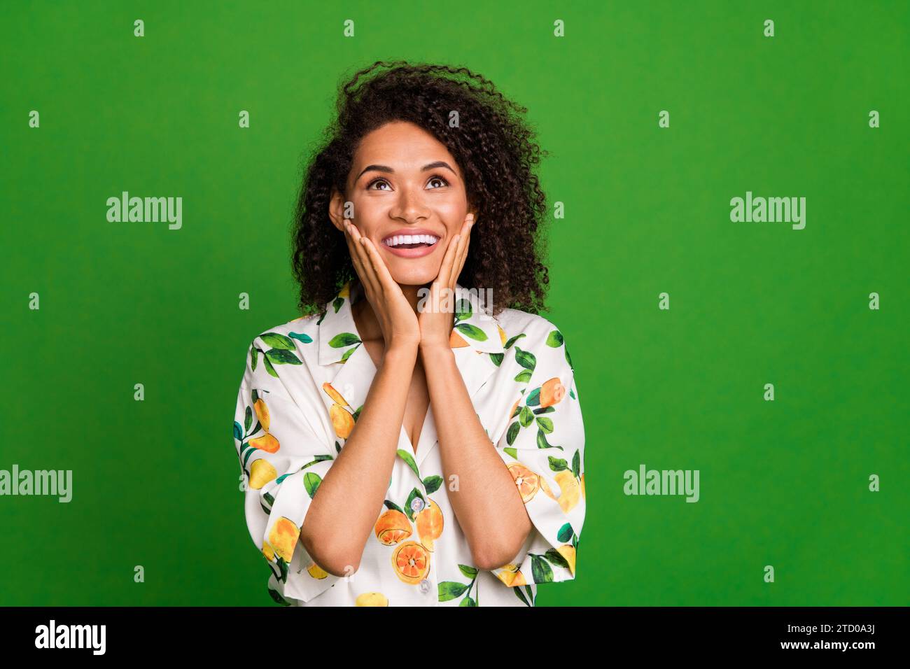 Photo portrait of lovely young lady touch cheeks look up admire dressed ...