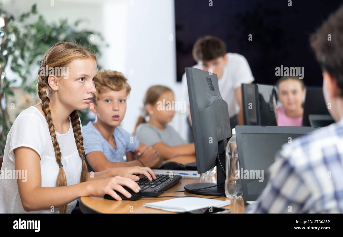 Portrait of female schoolgirl at computers in computer class Stock ...