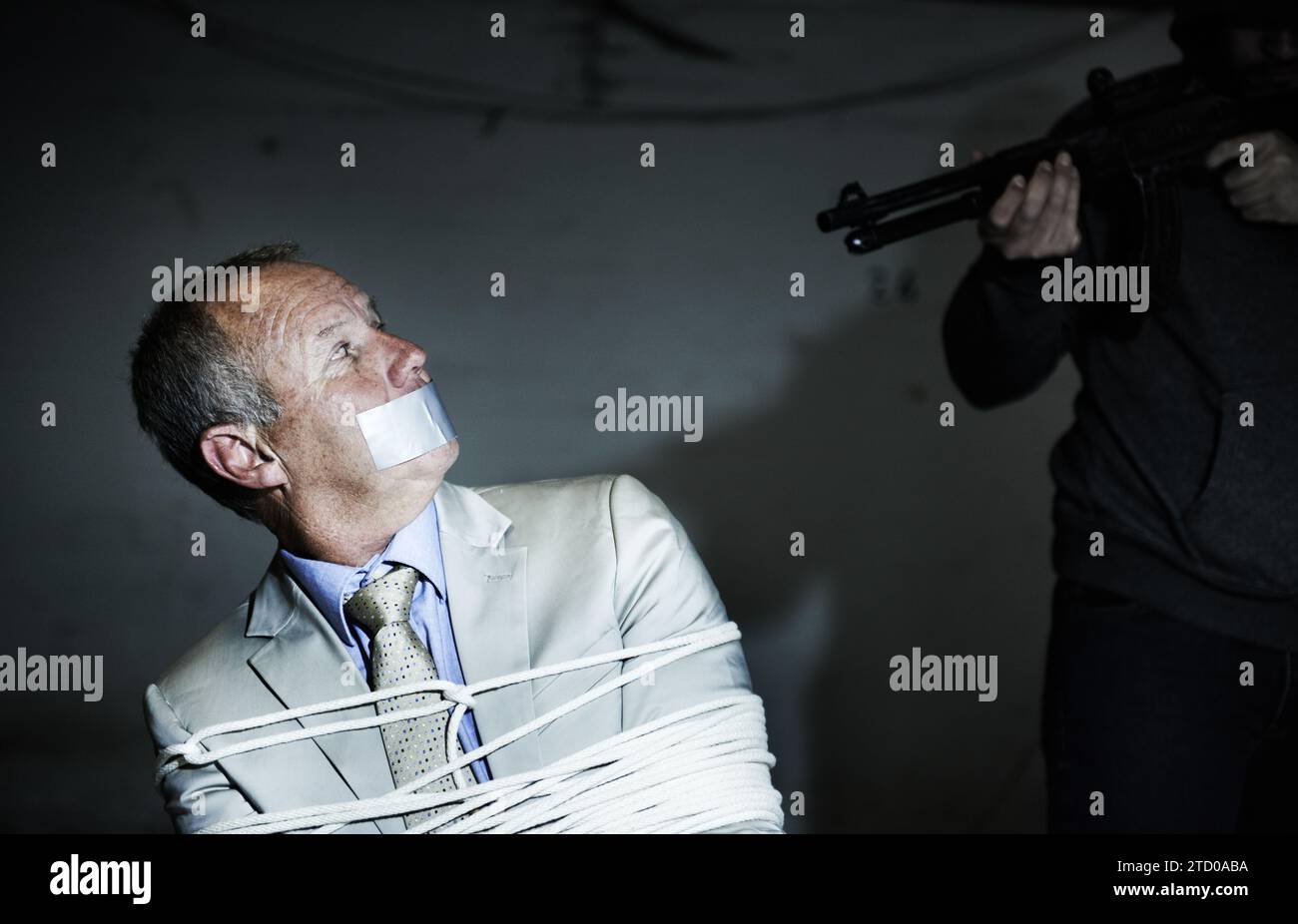 Scared man, kidnap and hands with gun for crime, ransom and negotiation ...