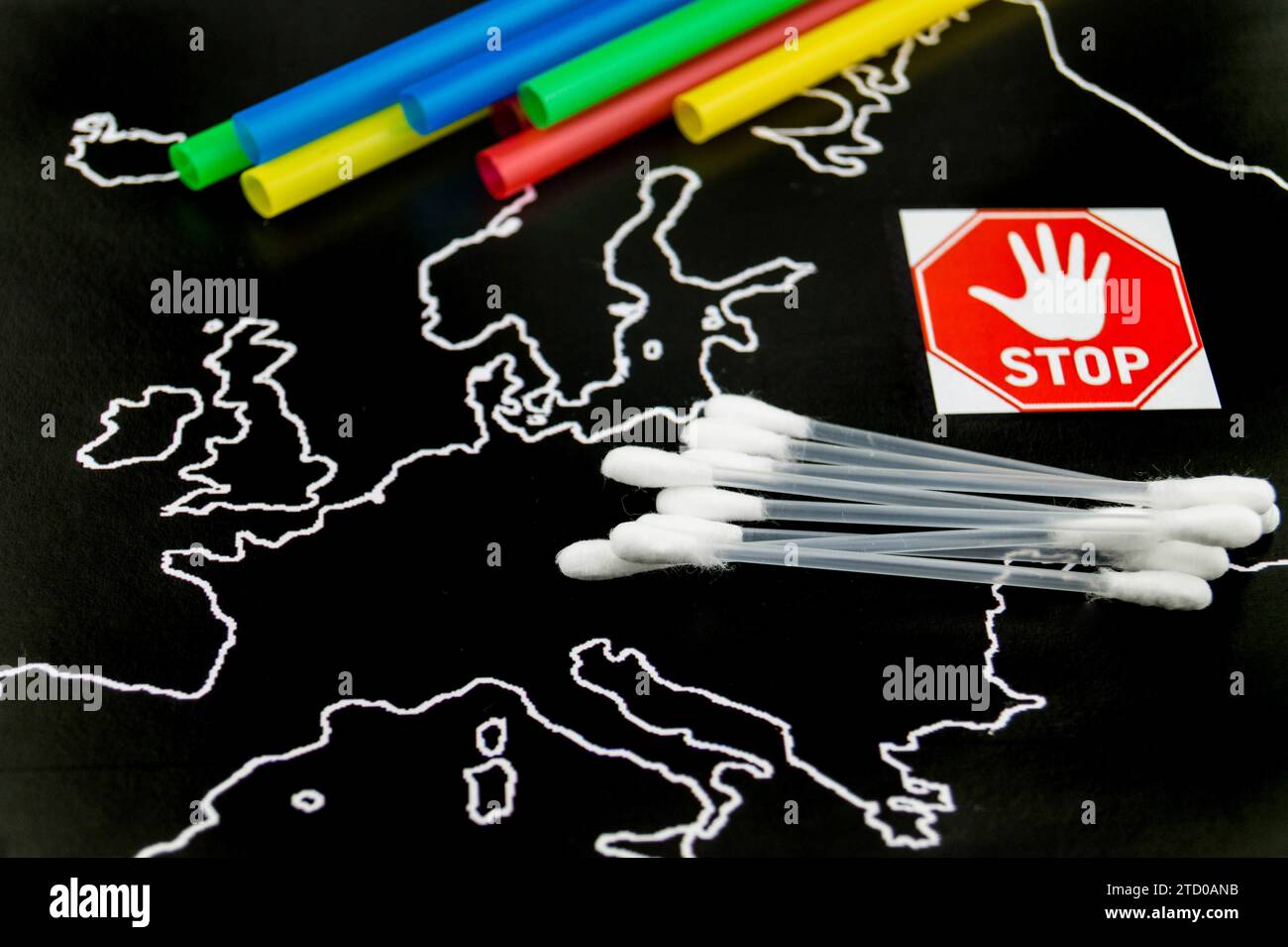 Plastic straws and cotton buds on a map of Europe with a stop sign, ban ...