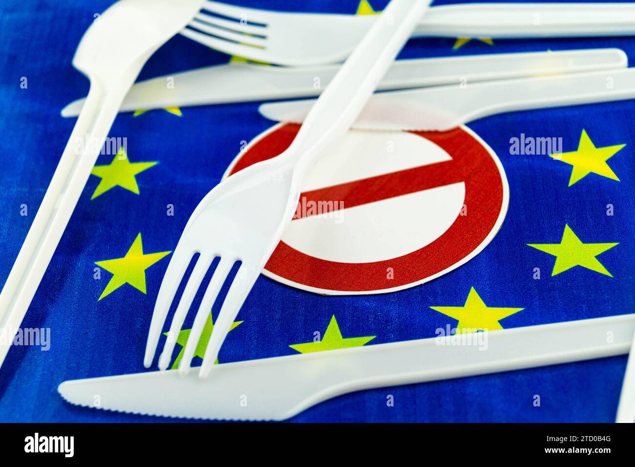 Plastic cutlery on European flag with prohibition sign, ban on plastic ...