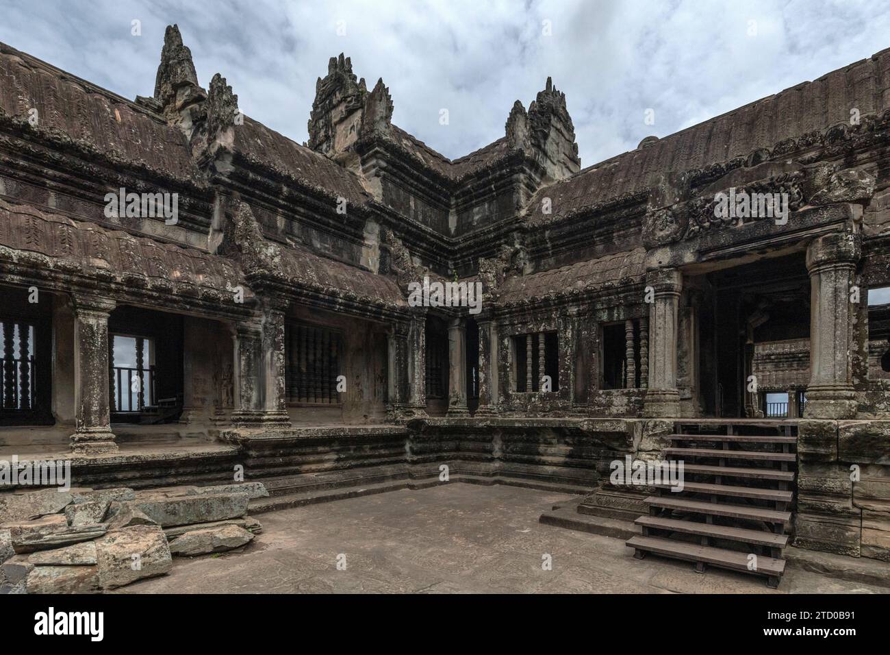 Moody overcast skies loom above the ancient temple ruins of the Angkor ...