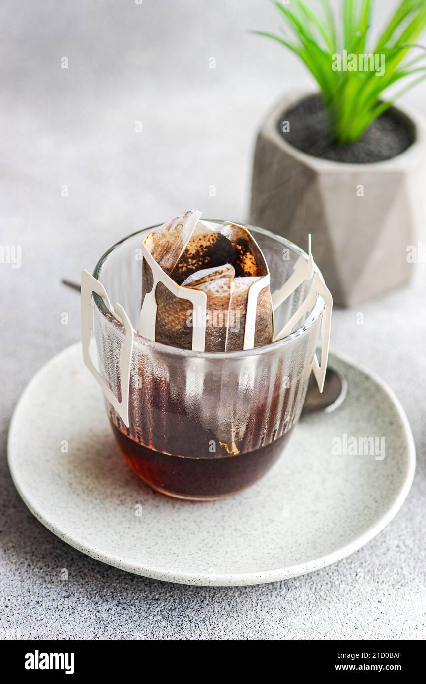 A close-up image showcasing the process of making drip coffee with a ...