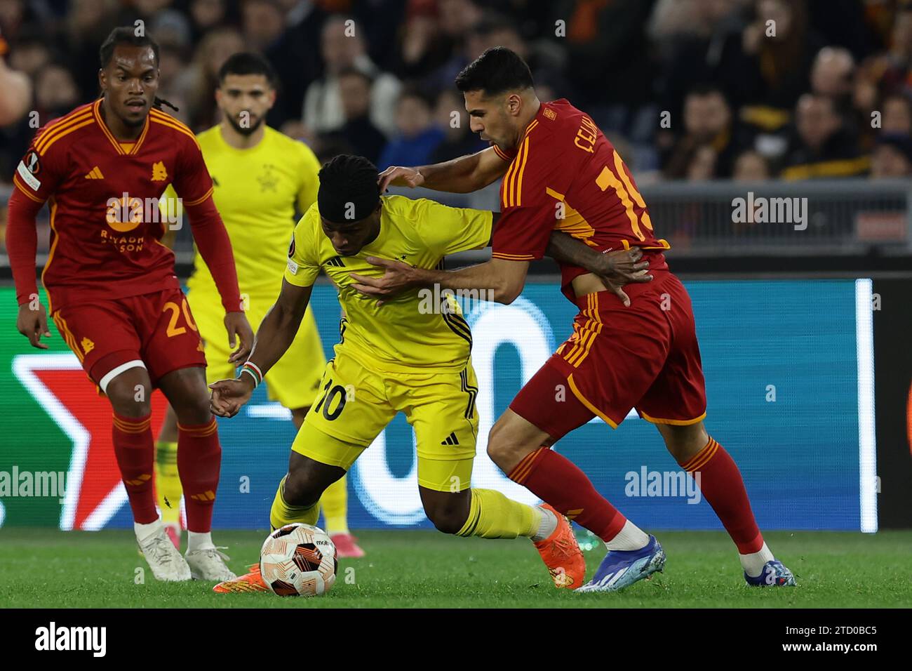 Roma’s Turkish defender Zeki Celik challenges for the ball with Sheriff ...