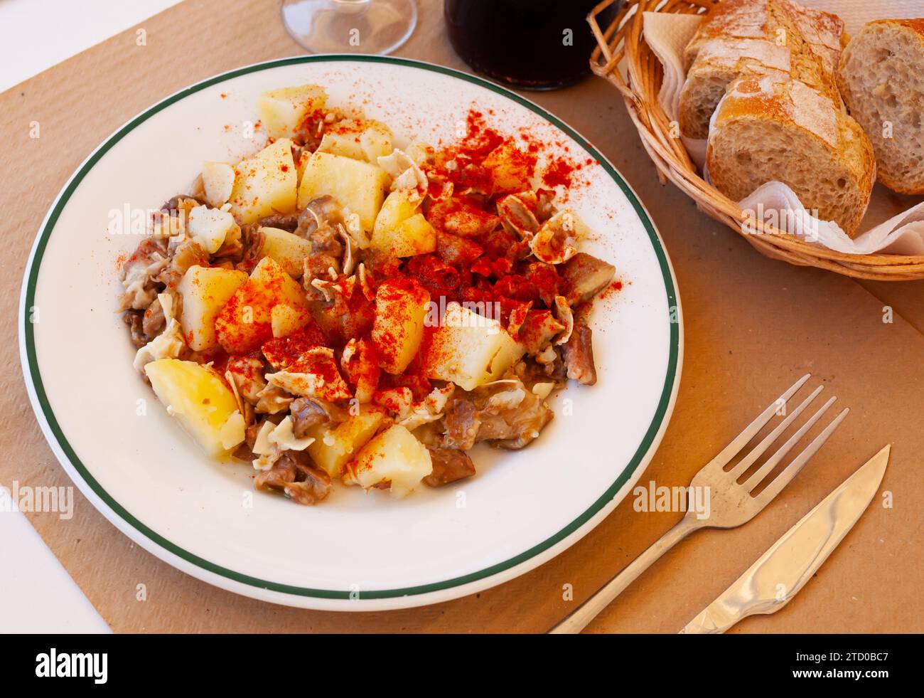 Spanish dish - roasted pig ears with spices Stock Photo - Alamy