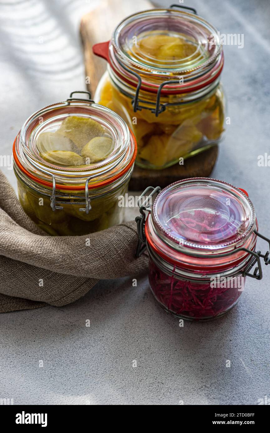 Three jars with assorted fermented vegetables, including cabbage with ...