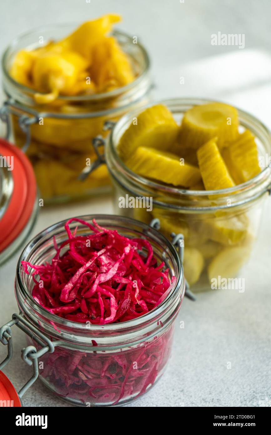 A vibrant display of fermented vegetables, featuring cabbage with ...