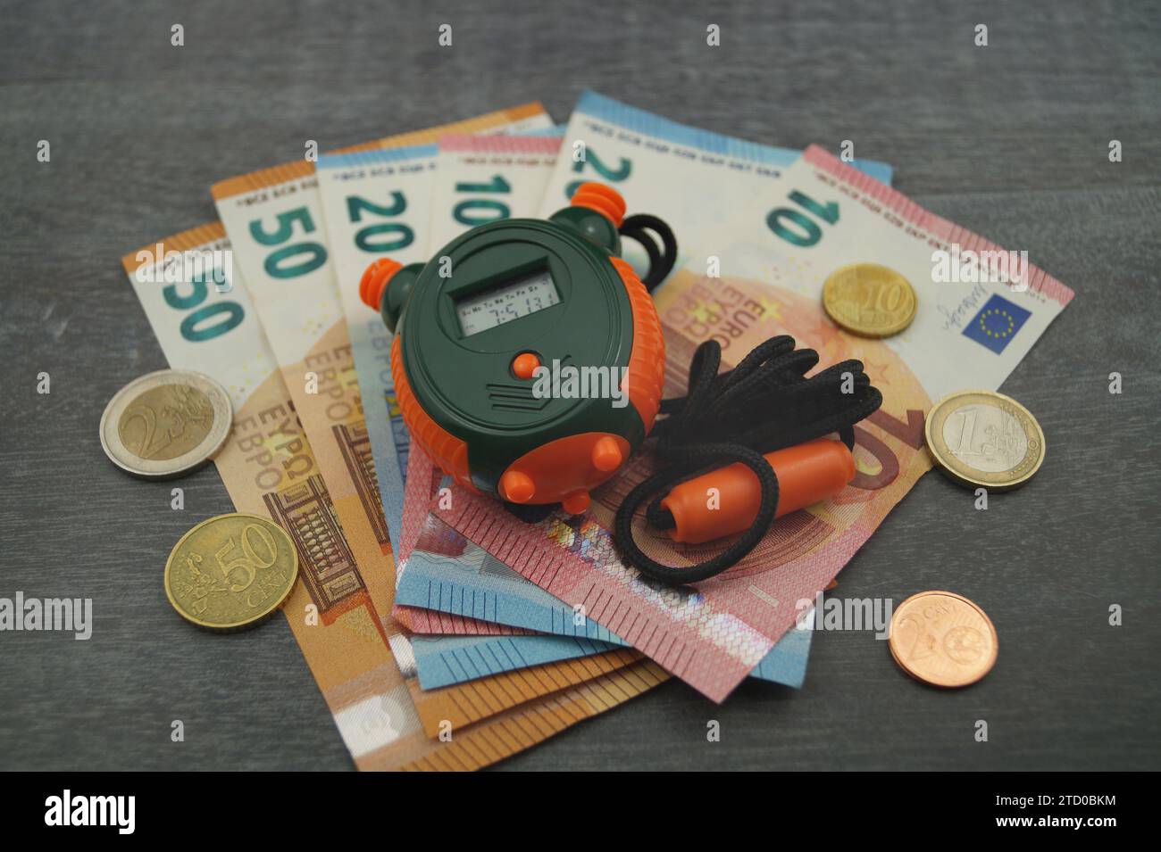 money and stop watch Stock Photo - Alamy