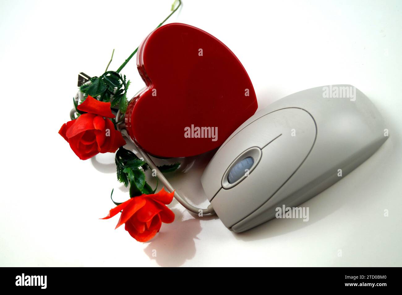 red heart and red roses with computer mouse, symbol image of love ...