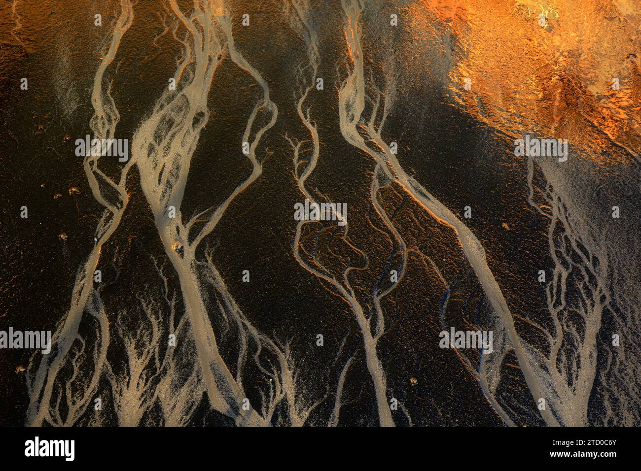 An aerial shot captures the intriguing patterns of a river delta, with ...