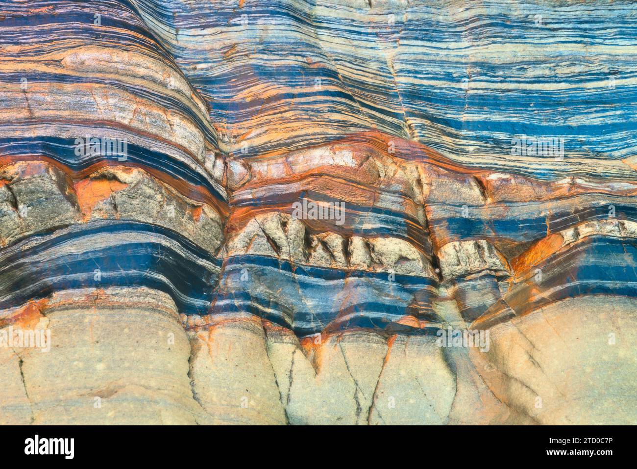 A close-up image showcasing the intricate and colorful layers of a rock ...