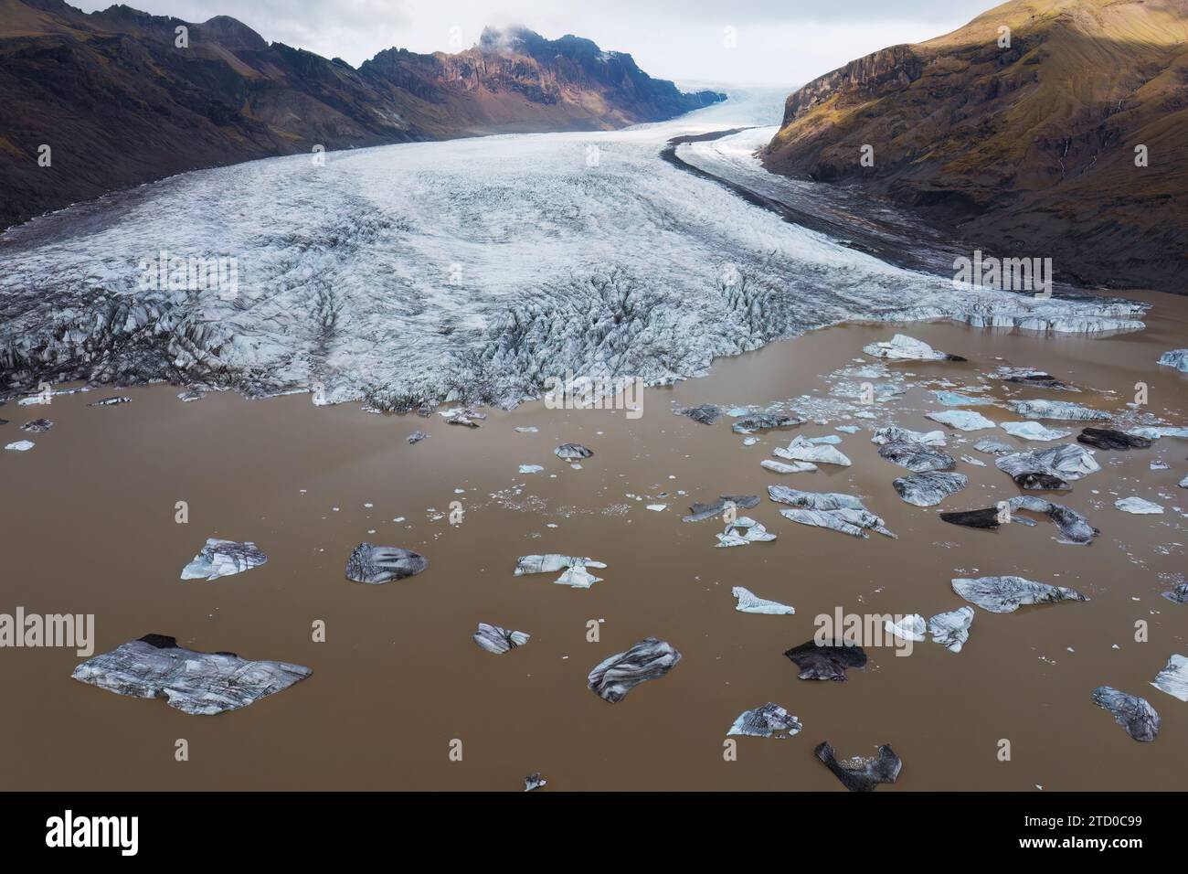 Aerial view of a glacial river with floating ice in Iceland's dramatic ...