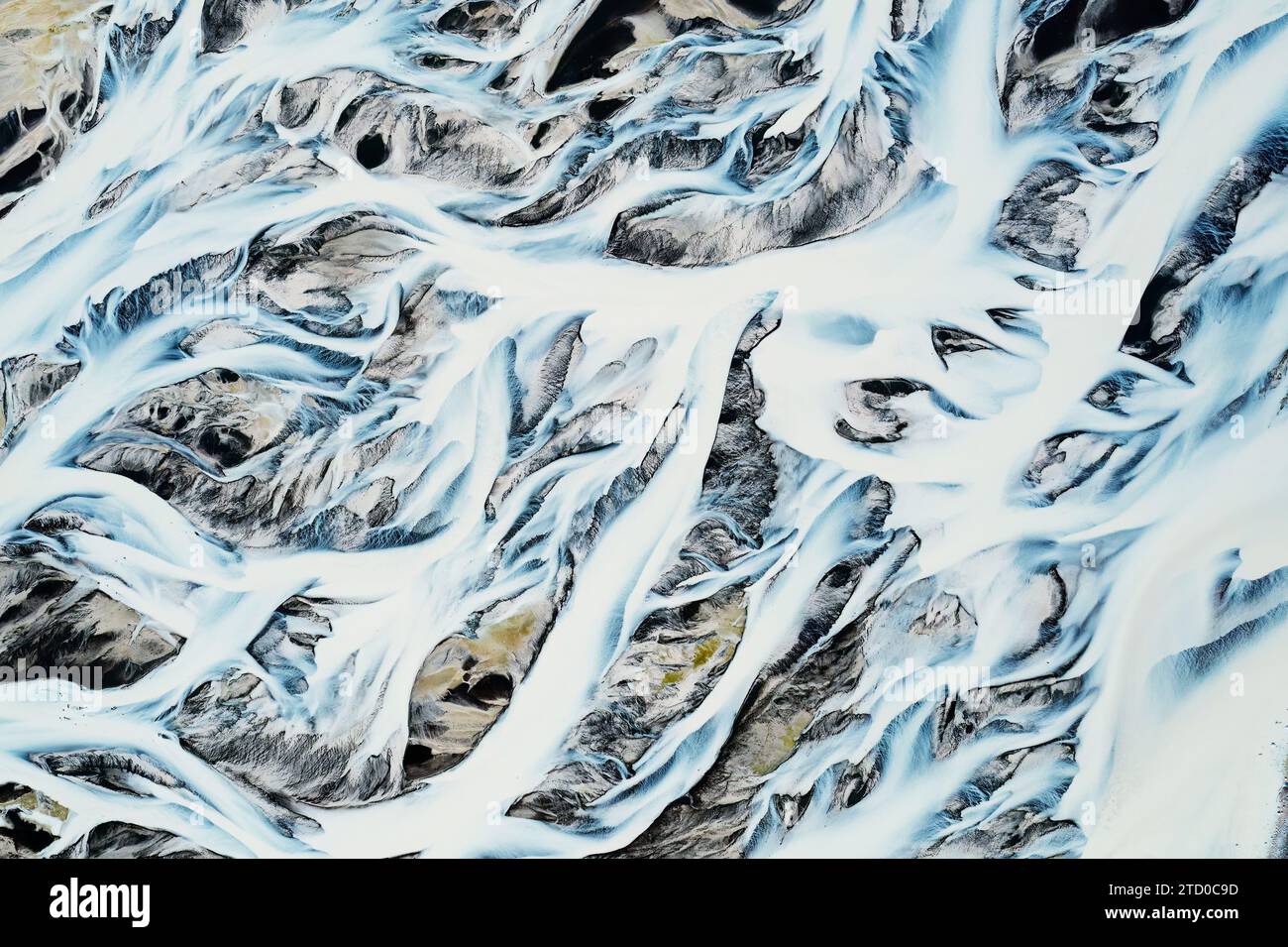 An aerial snapshot capturing the intricate patterns of river basins ...
