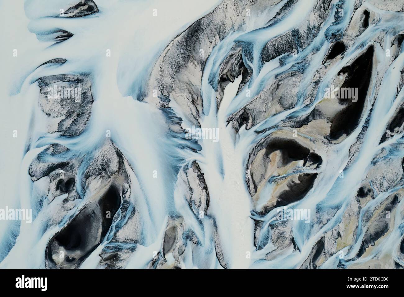 Captivating aerial of frozen river basins in Iceland, showcasing nature ...