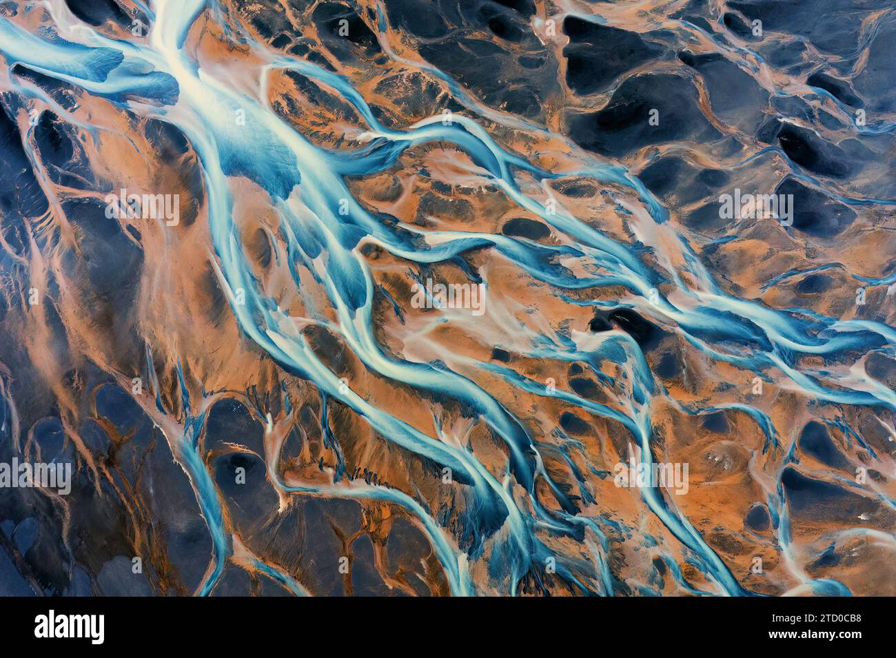 An aerial shot capturing the stunning abstract beauty of a river basin ...
