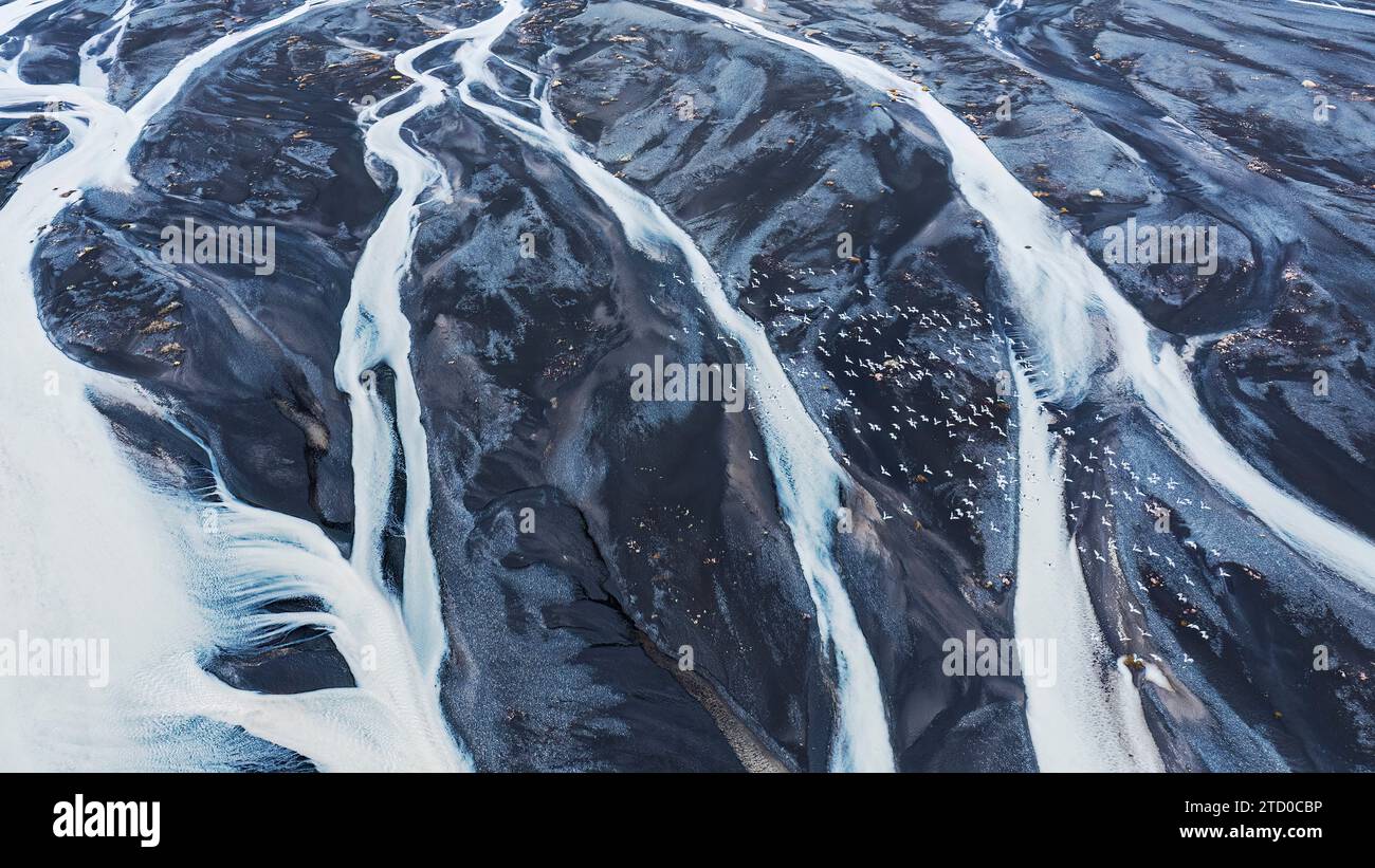 An aerial shot captures the intricate details of a river basin in ...