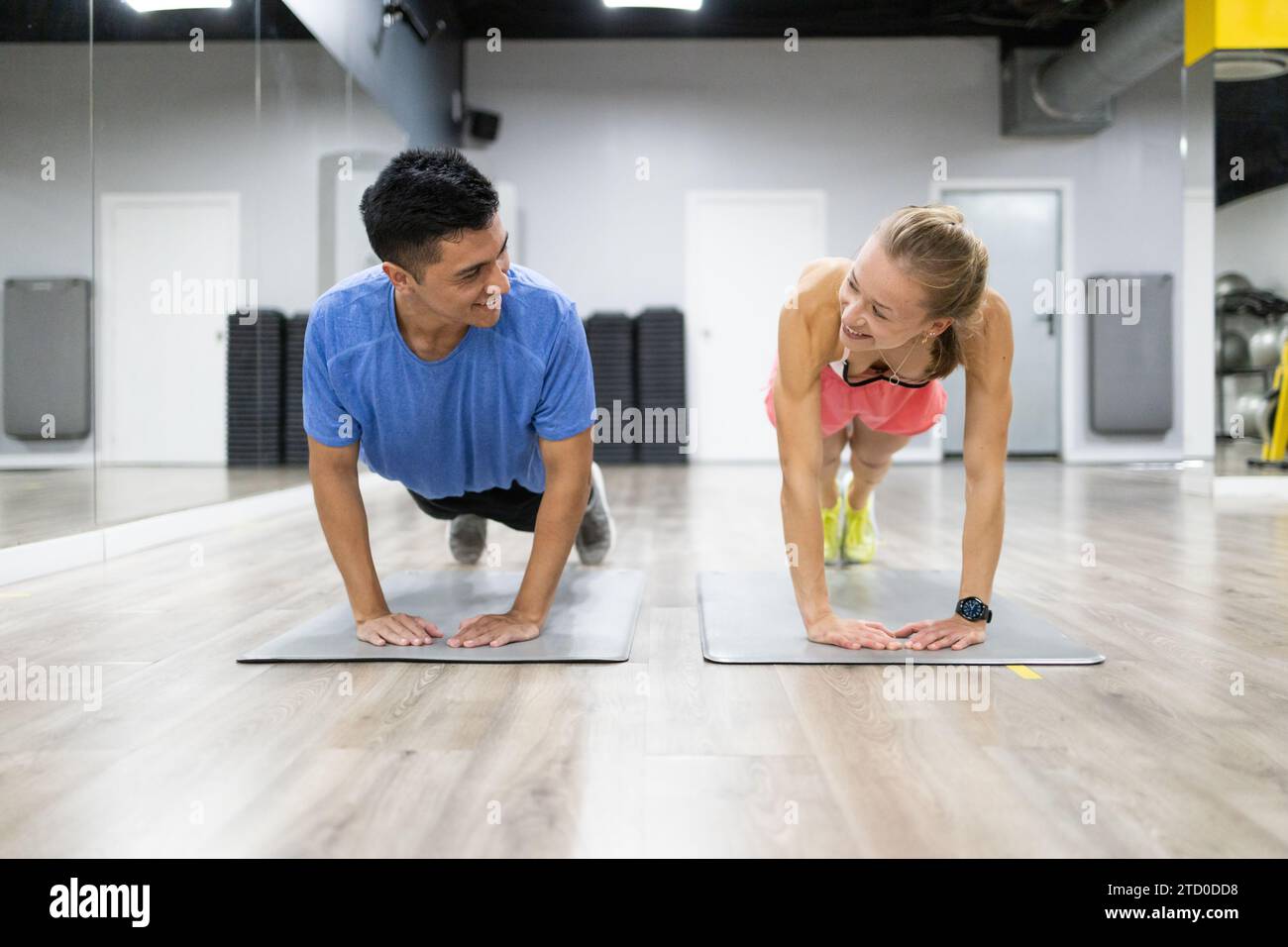 Two happy partners, a man and a woman, are engaging in a friendly ...