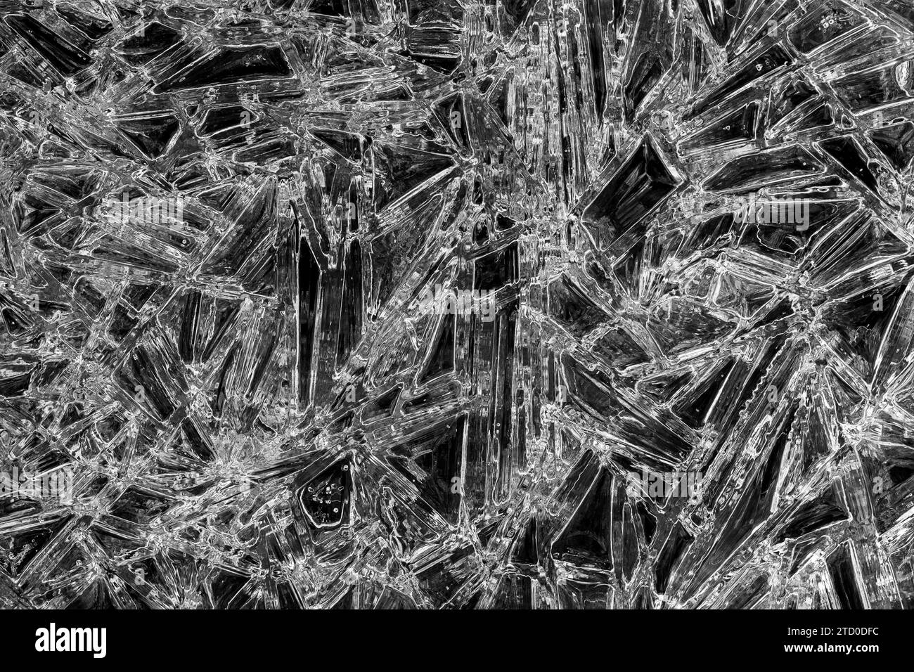 Top view textured background of frozen water with cracks and scratches ...