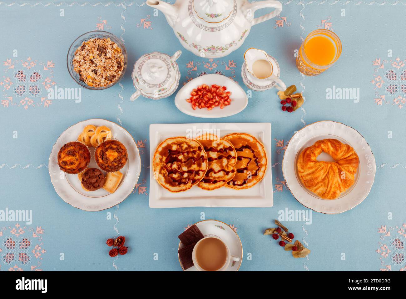 A top-view of a continental breakfast setup featuring pastries, cereal ...