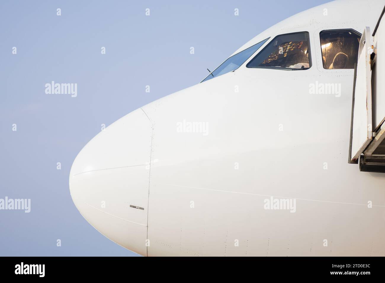 A close-up view of the cockpit windows of an airplane, with the ...