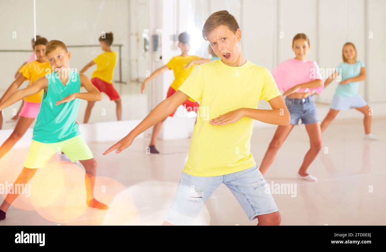 Tween boy training movements of vigorous dance in choreographical ...