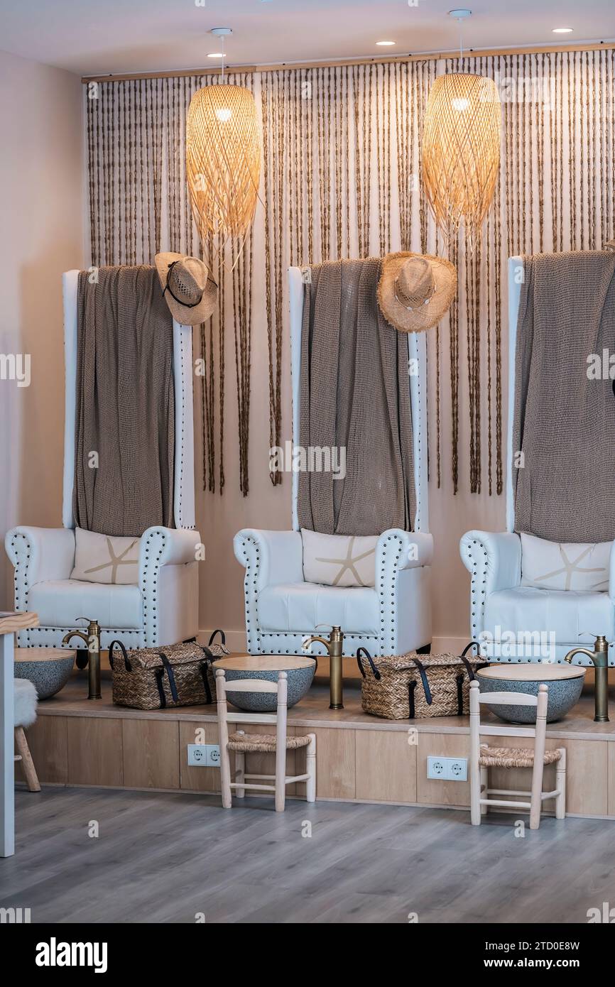 Interior design of illuminated spacious room with comfortable chairs in ...