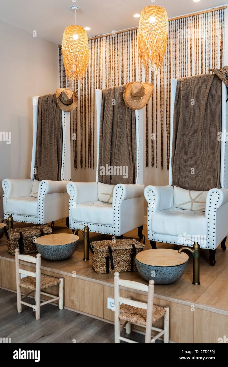 Interior design of illuminated spacious room with comfortable chairs in ...