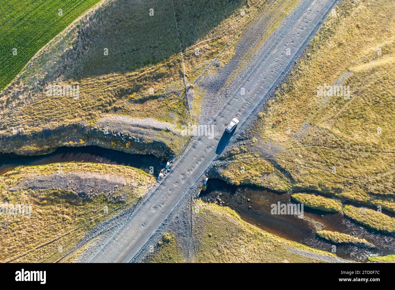 An aerial photograph capturing a car on the serpentine paths of a ...